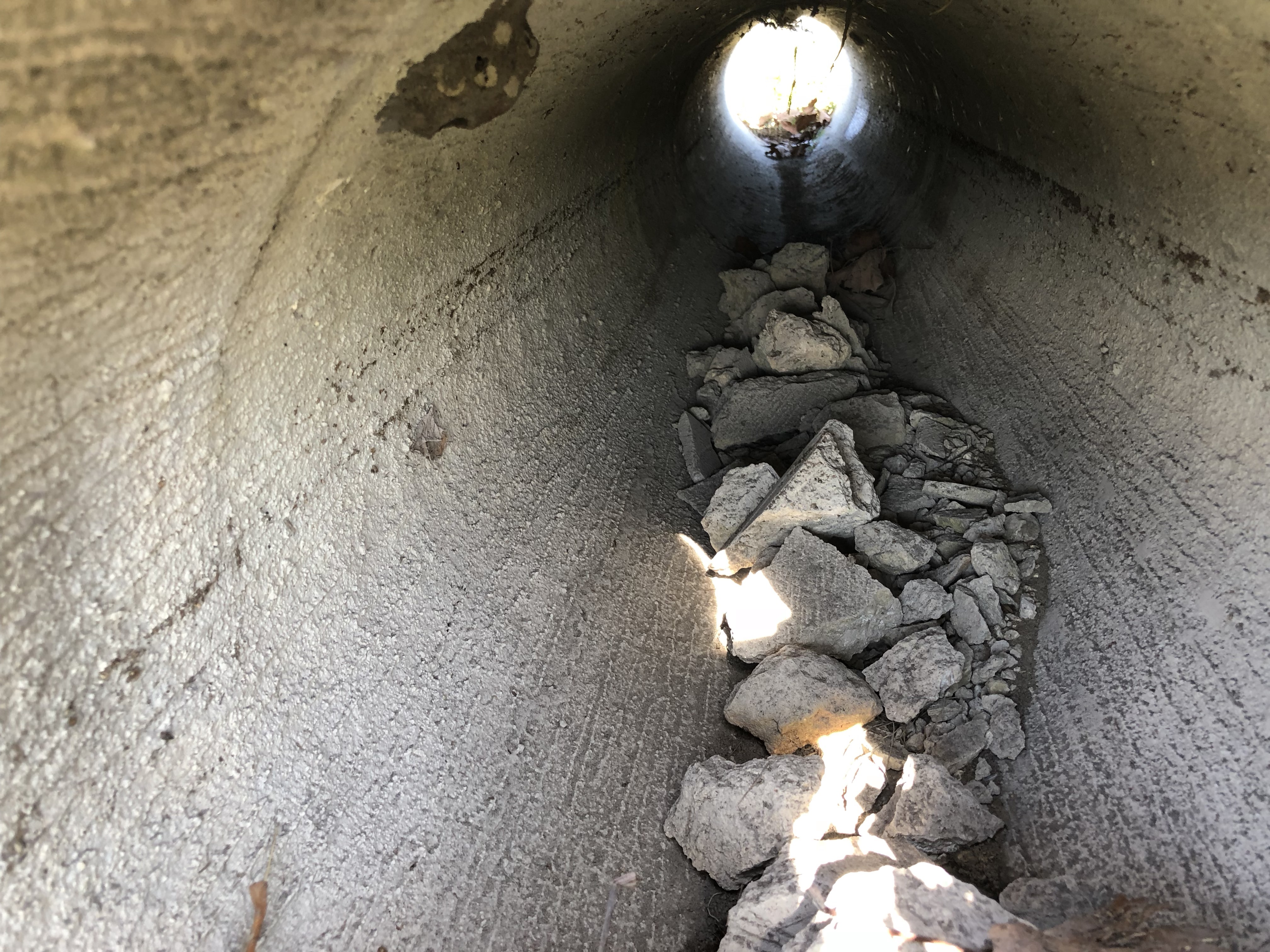 Rocks inside of a drainpipe | Pics4Learning