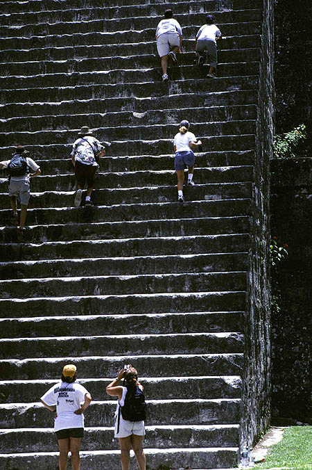 Tourists have to be careful climbing the steep and narrow steps of a ...